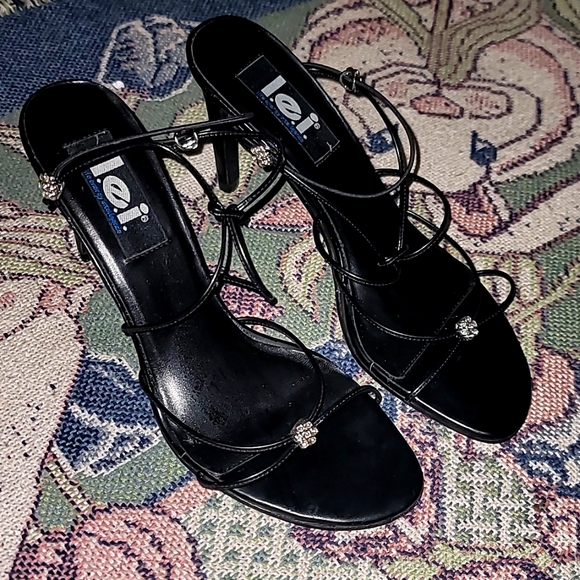 lei | Shoes | Lei Strappy Heels Flower Stud Jewelry Black Faux Leather ...